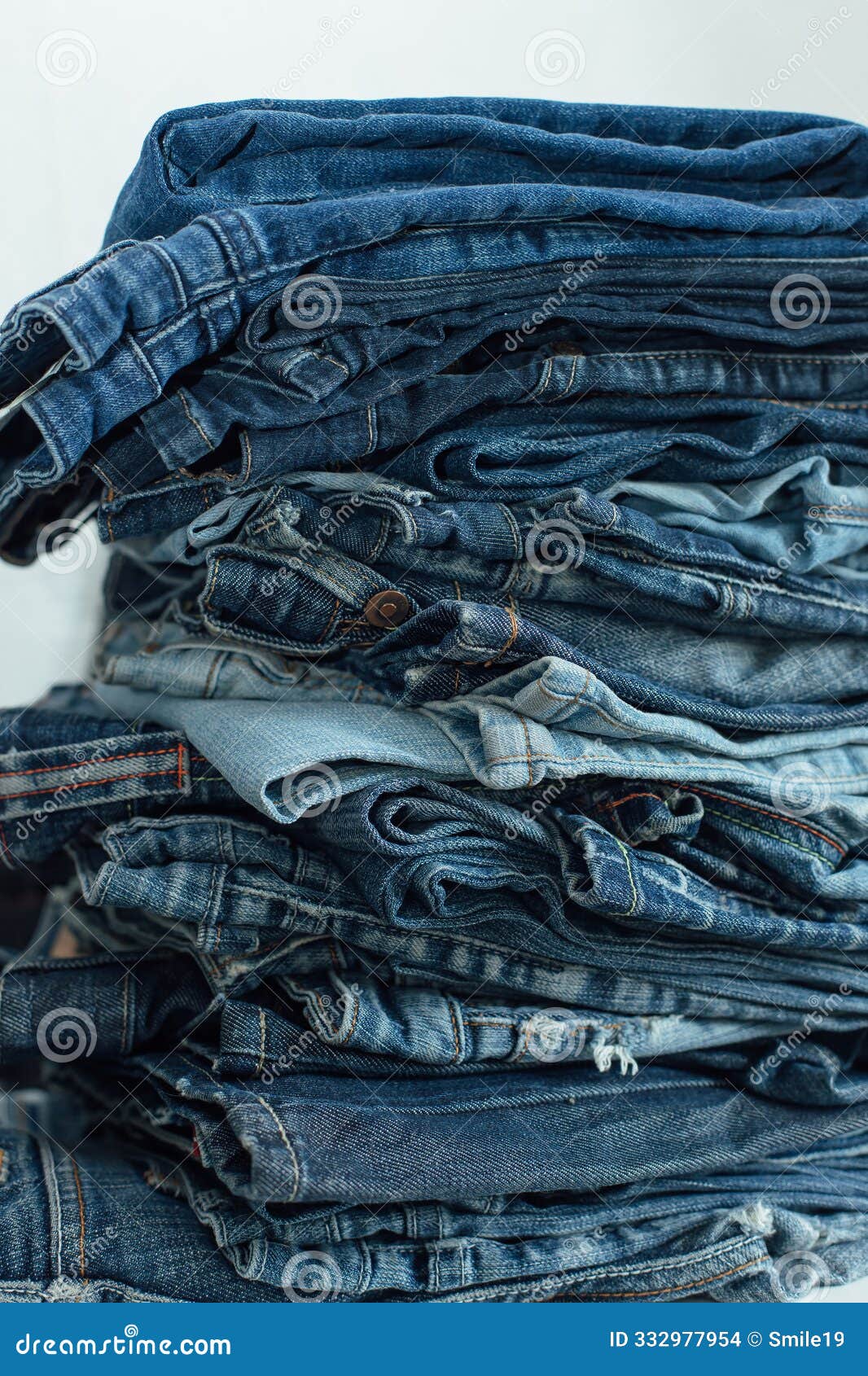 Stack of a Stack of Old Jeans Various Shades of Blue Jeans. Denim Jeans ...
