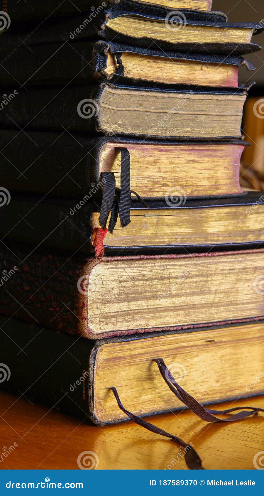 A Stack of Old Leather Bound Books and Bibles Sitting on a Table. Stock ...