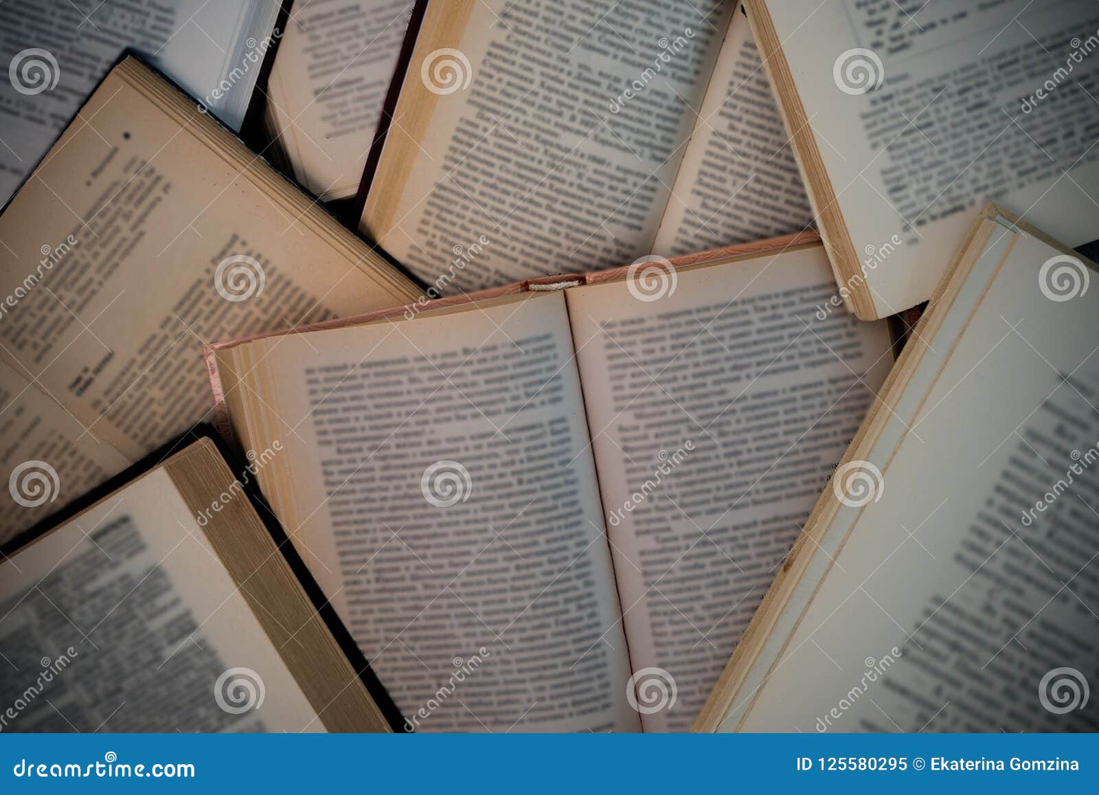 A Stack of Old Opened Books Laying on the Floor. Selective Focus Stock ...