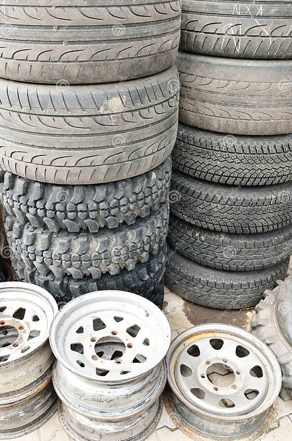Stack of Old Tires and Metallic Rims Stock Photo - Image of wheels ...