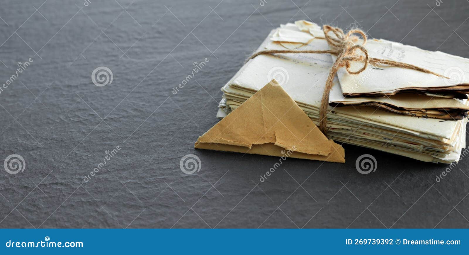 Stack of Old Torn Vintage Letters on Yellowed Paper Against Black ...