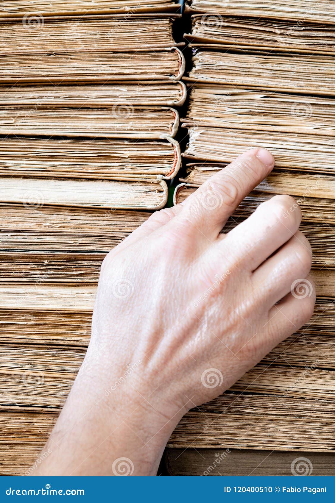 Classic Reading Vintage Aged Books Stack with Human Hand Stock Photo ...