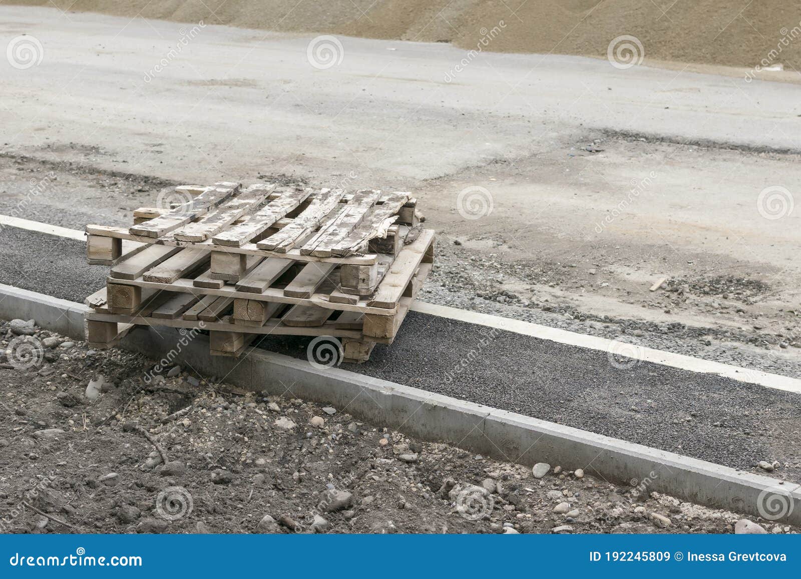 A Stack of Old Wooden Pallets on the Asphalt Path. Stock Image - Image ...