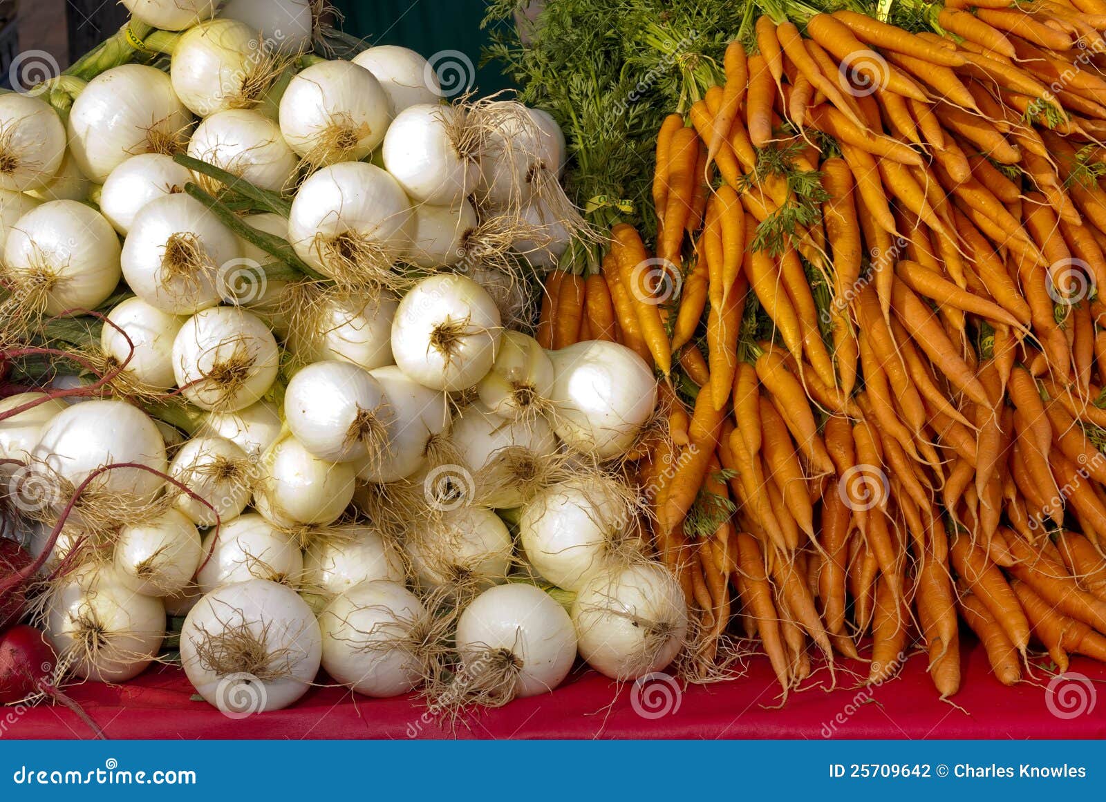 Stack of Onions and Carots on a Table Stock Photo - Image of carrots ...