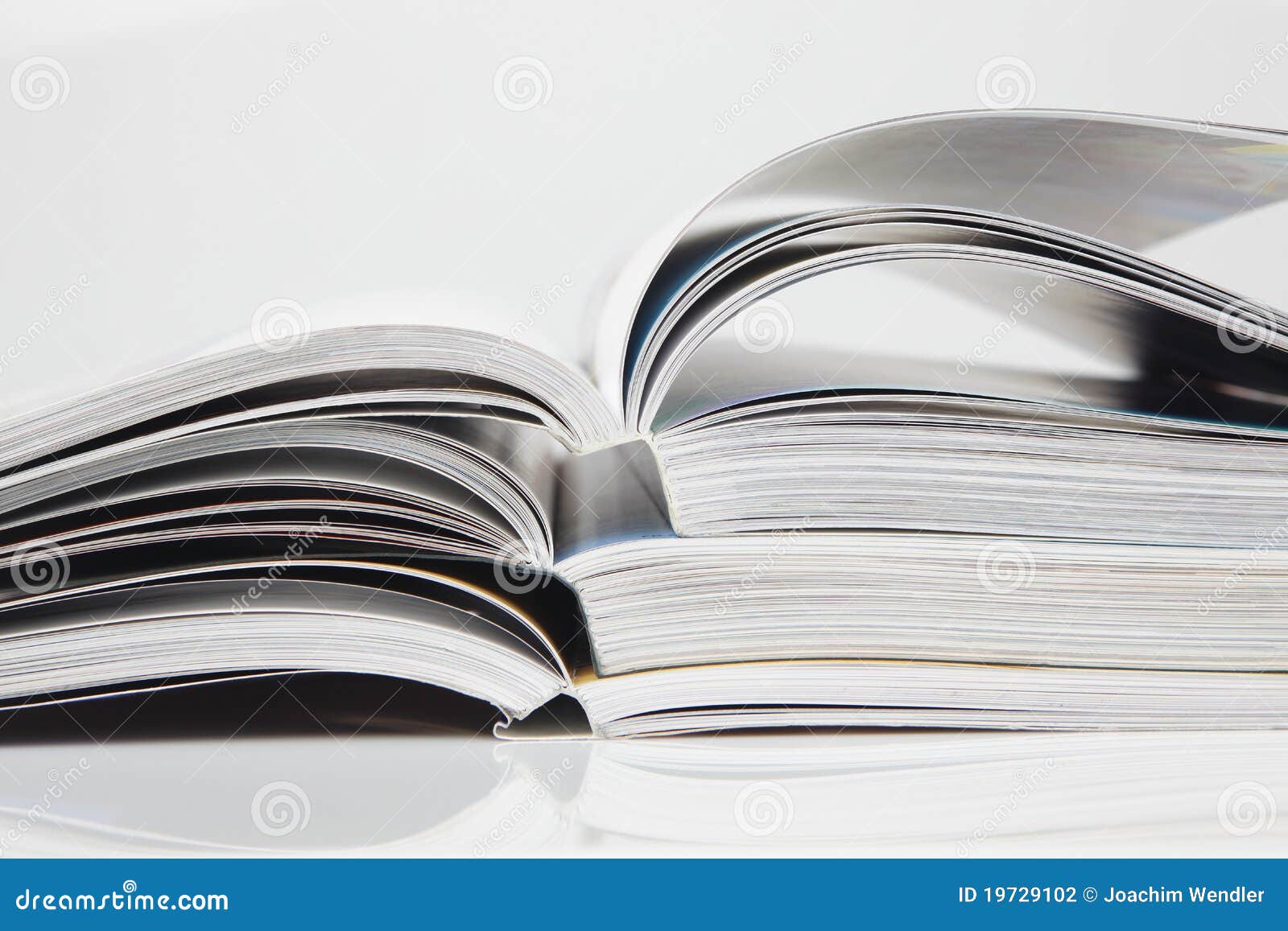 Stack of open magazines stock photo. Image of document - 19729102