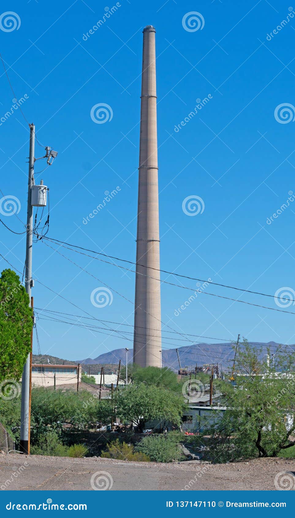 Stack from an Ore Smelter Against the Blue Sky on the Edge of Town ...