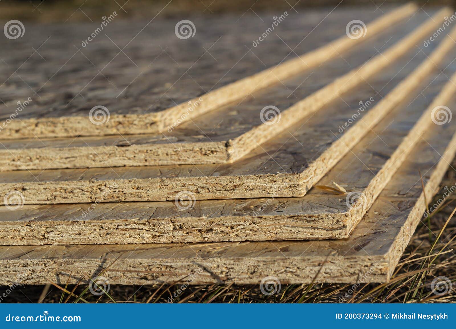 A Stack of OSB Sheets Lying on the Grass. Stock Photo - Image of ...