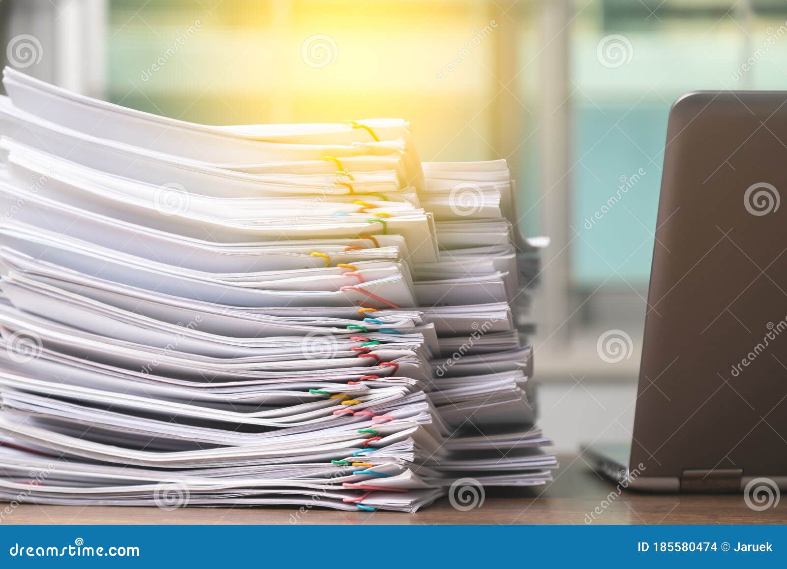 Stack Overload Document Report Paper with Laptop Computer for Work from ...