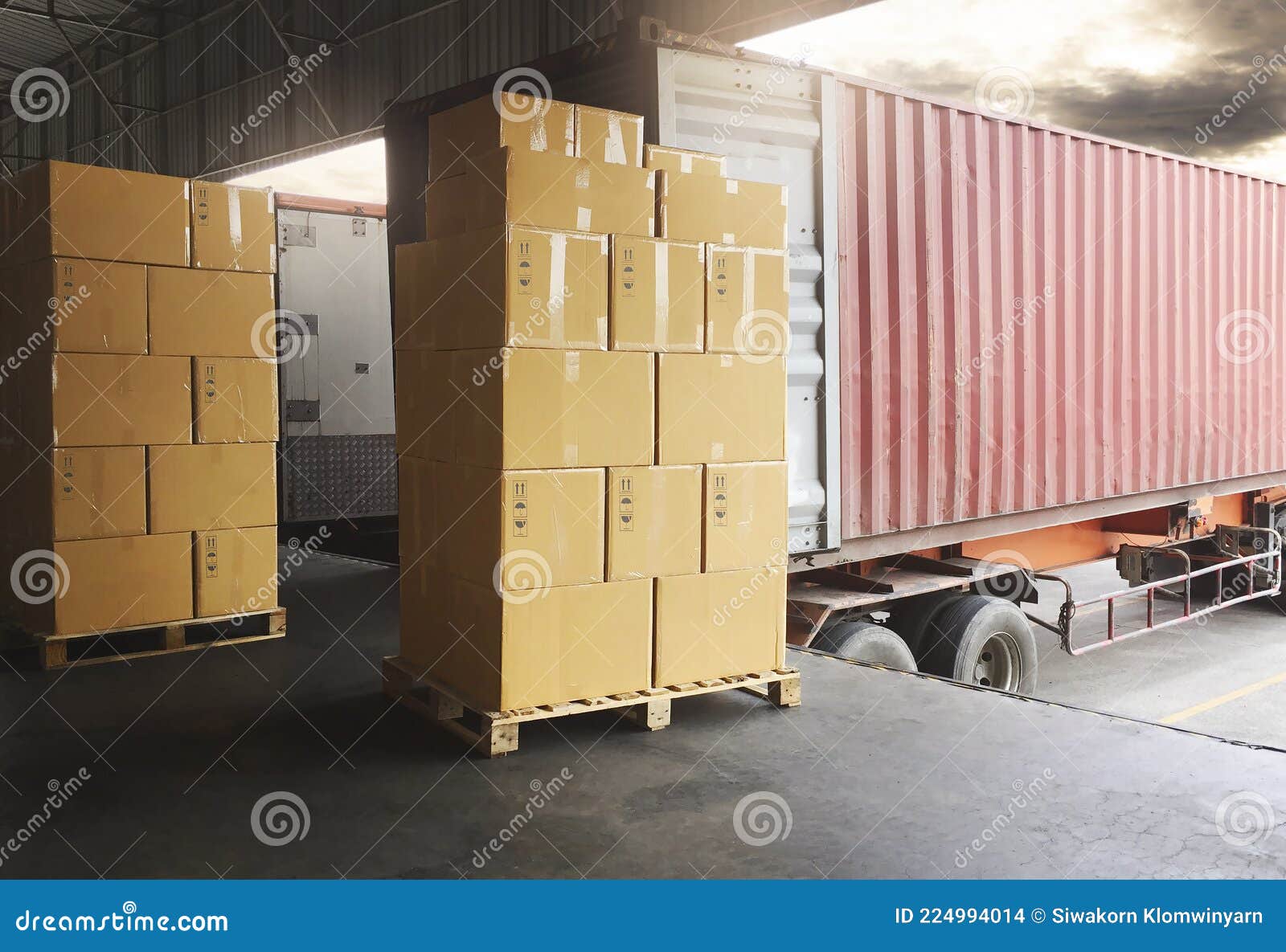 Stack of Package Boxes Load with Cargo Container. Trailer Truck Parked ...