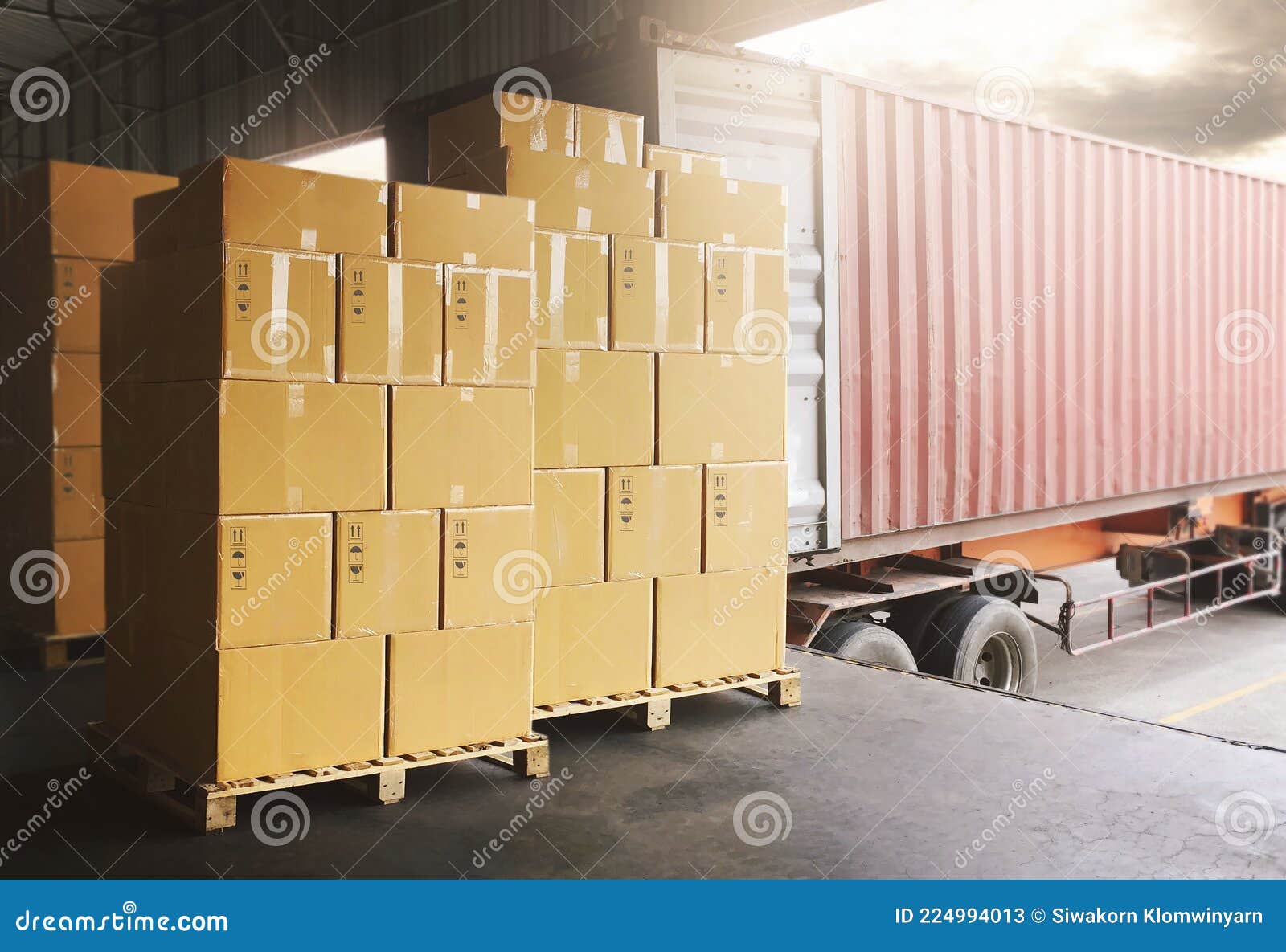 Stack of Package Boxes Load with Cargo Container. Trailer Truck Parked ...