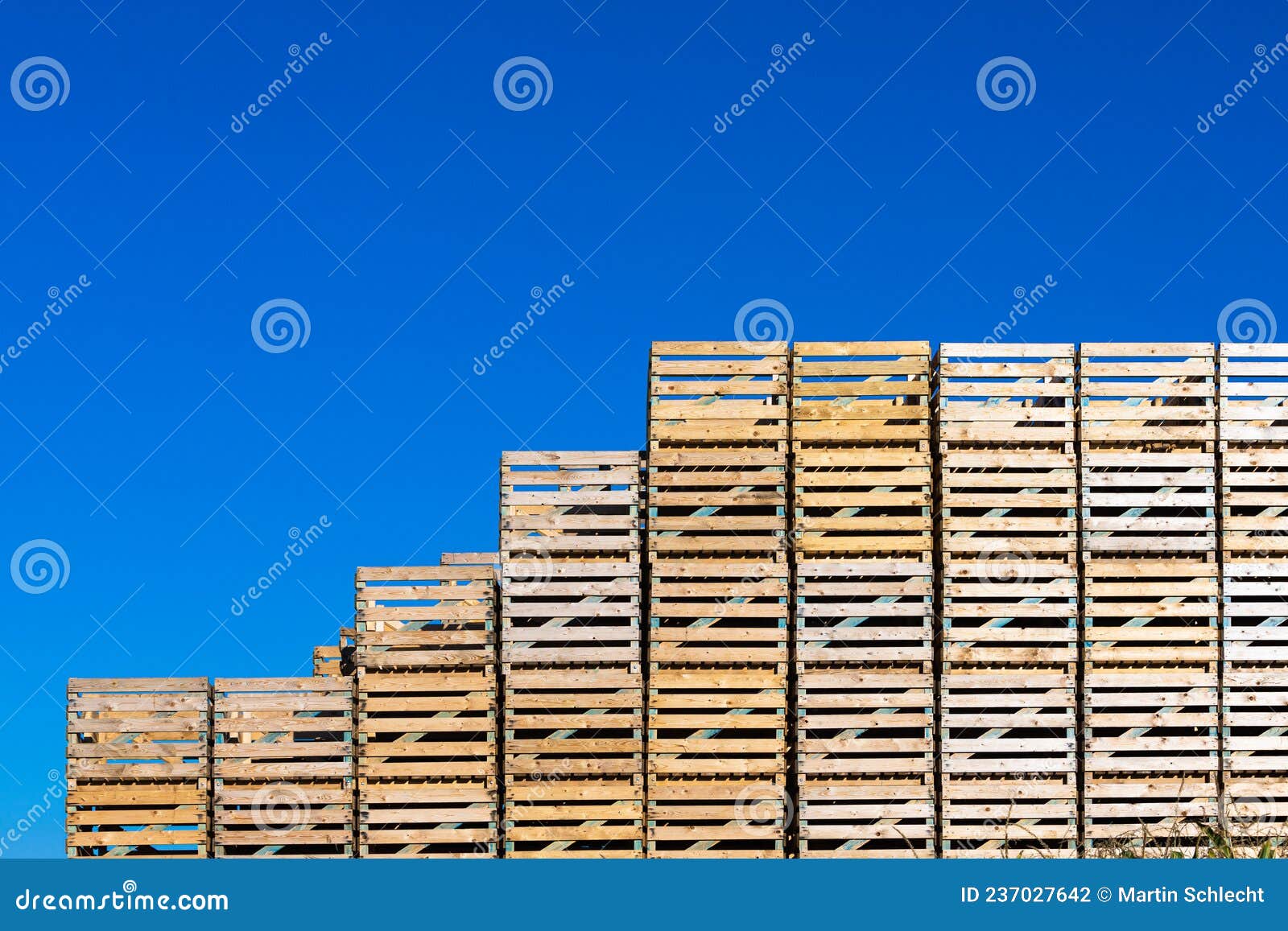 Stack of Pallets in Front of Blue Sky Stock Photo - Image of blue, pile ...
