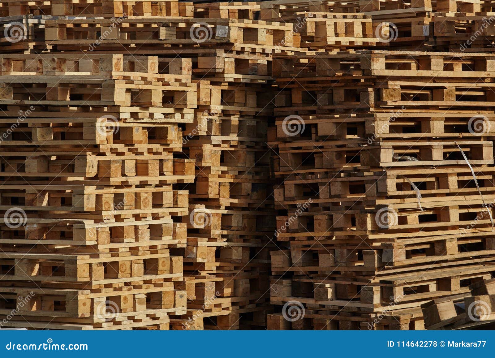 Stack of pallets outdoors. stock photo. Image of distribution - 114642278