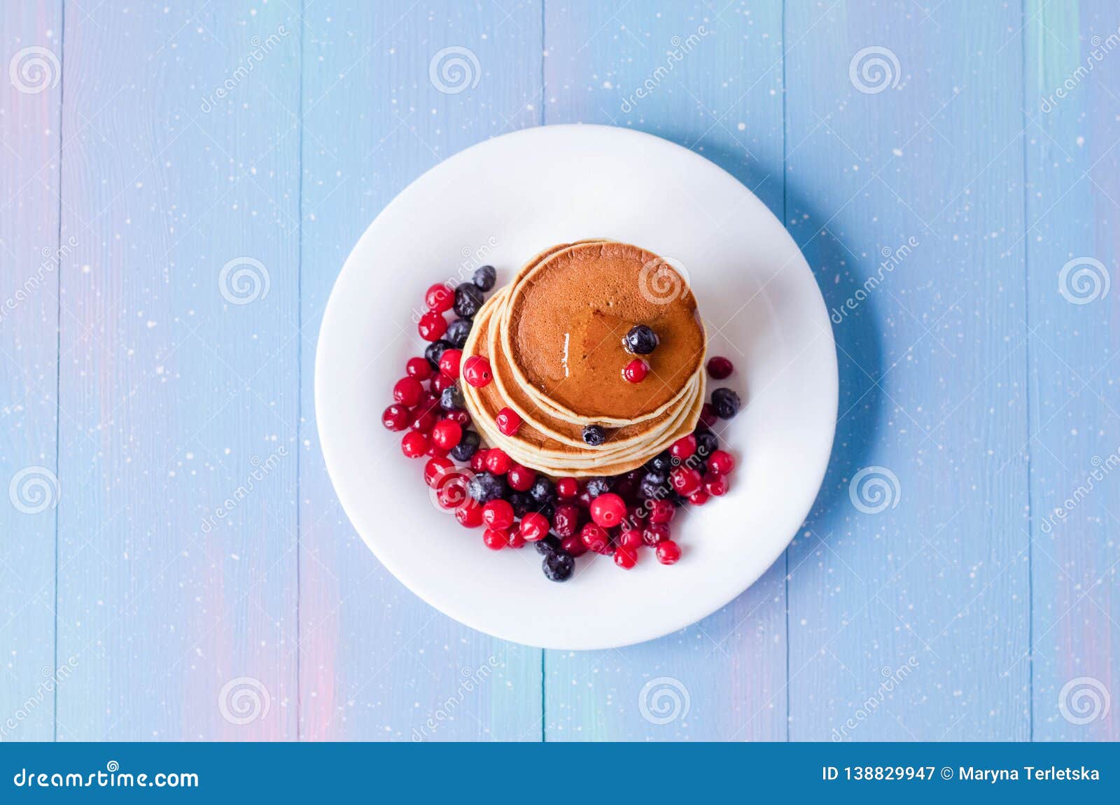 A Stack of Pancakes with Berries on a White Plate Stock Image - Image ...