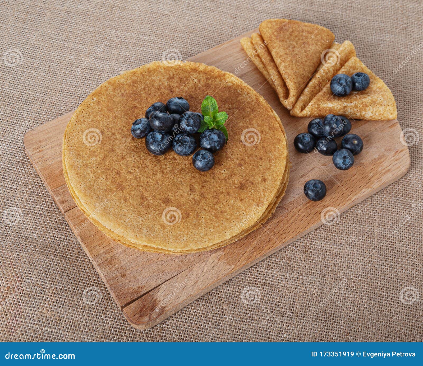 Pancakes with Fresh Berries and on a Wooden Board on a Linen Tablecloth ...