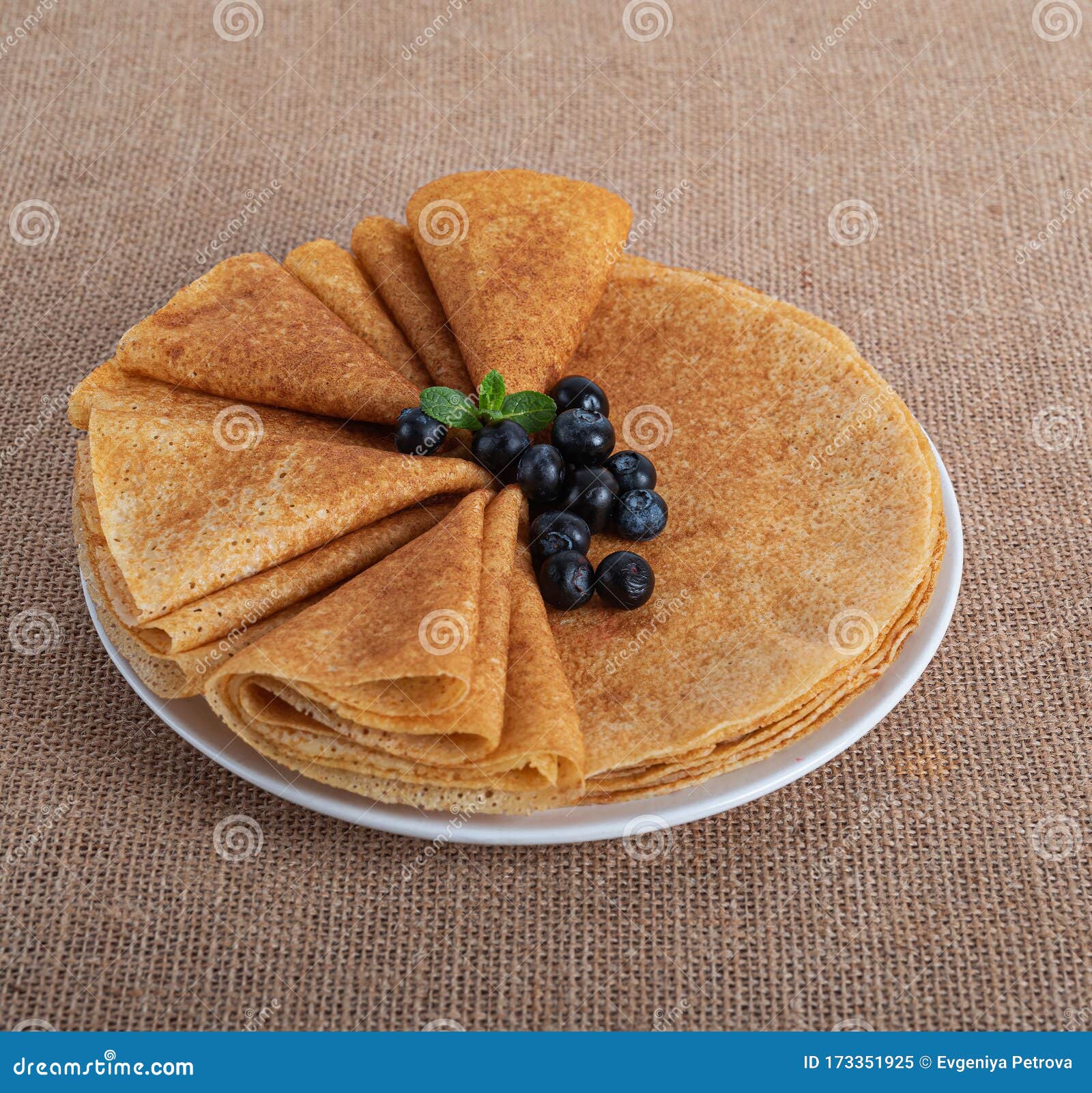 Pancakes with Fresh Berries and on a Wooden Board on a Linen Tablecloth ...
