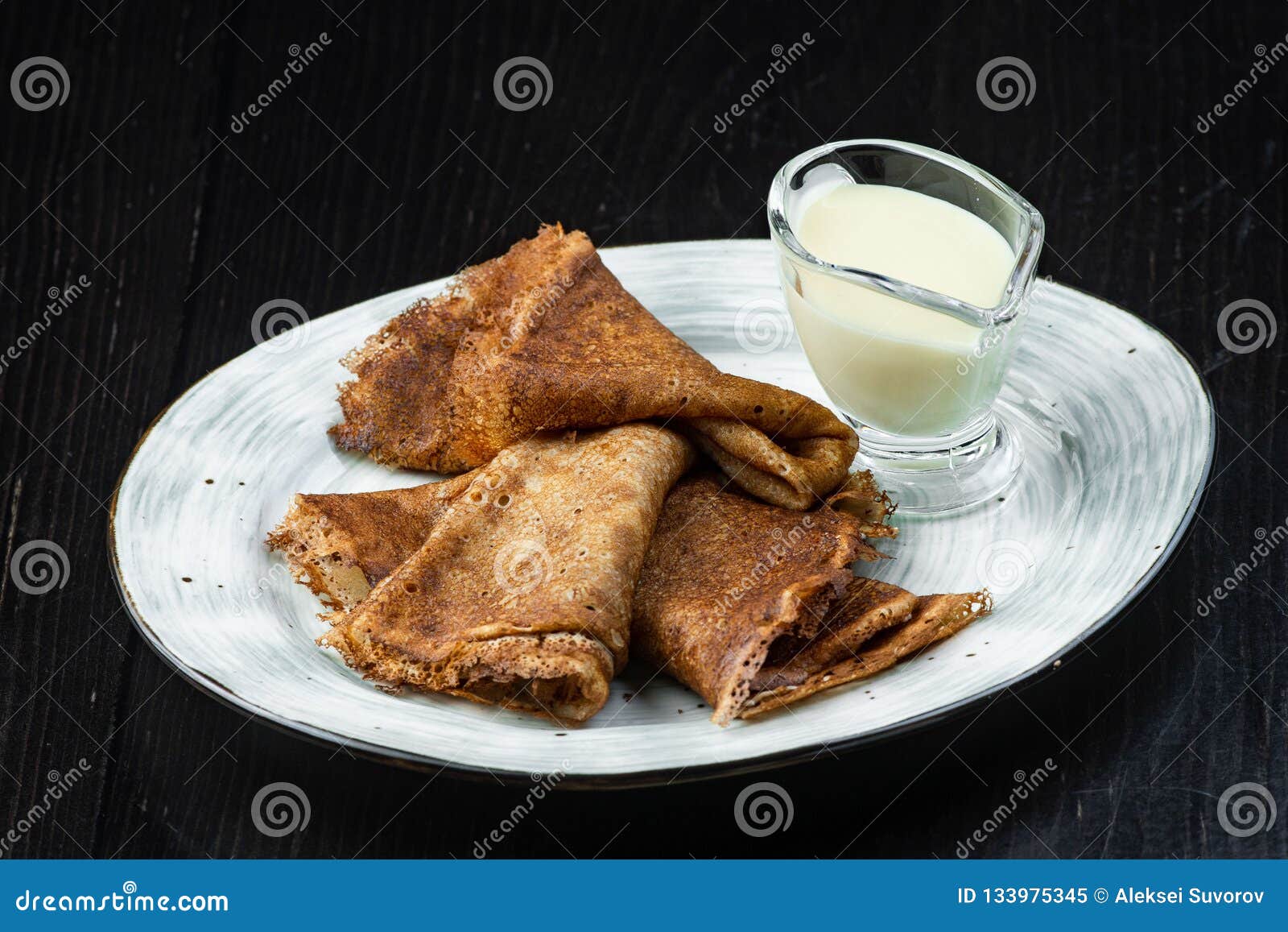 Stack of Pancakes on a Plate with Sour Cream. Traditional for the ...