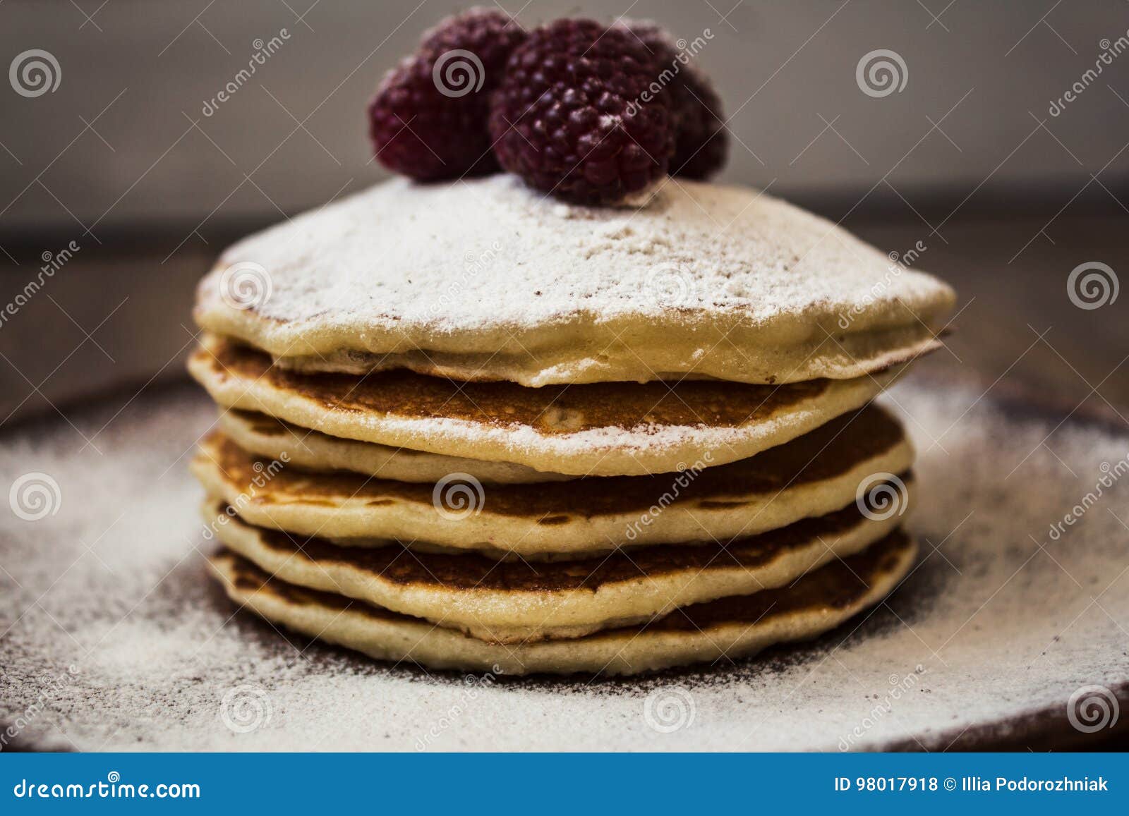 Stack of Pancakes with Sugar Powder and Raspberry Stock Photo - Image ...