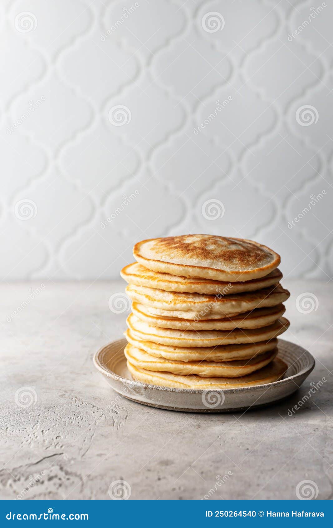Stack of Pancakes on Textured Background with Tile in Back and Copy ...