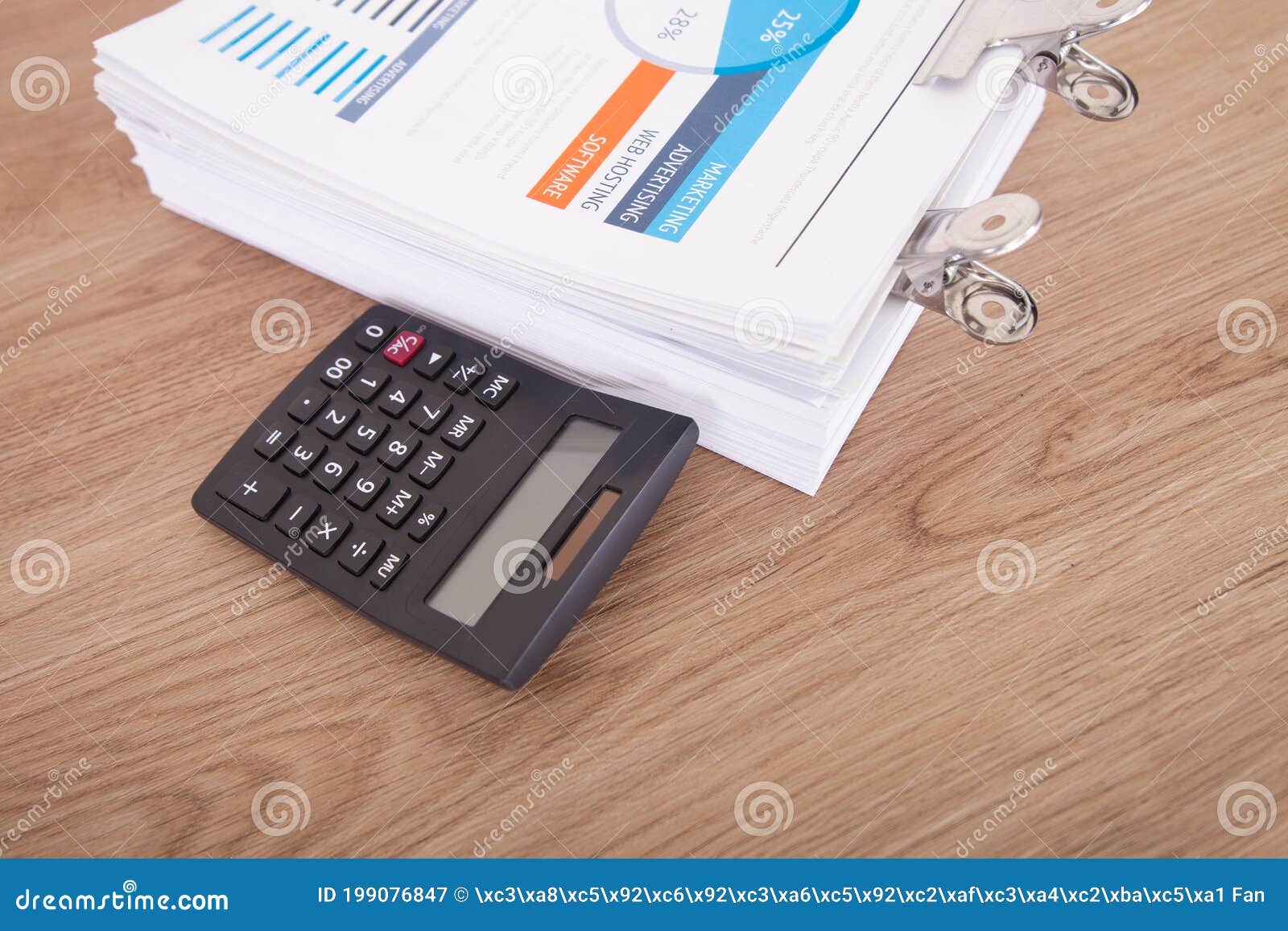 A Stack of Paper Business Documents and a Calculator on the Table Stock ...