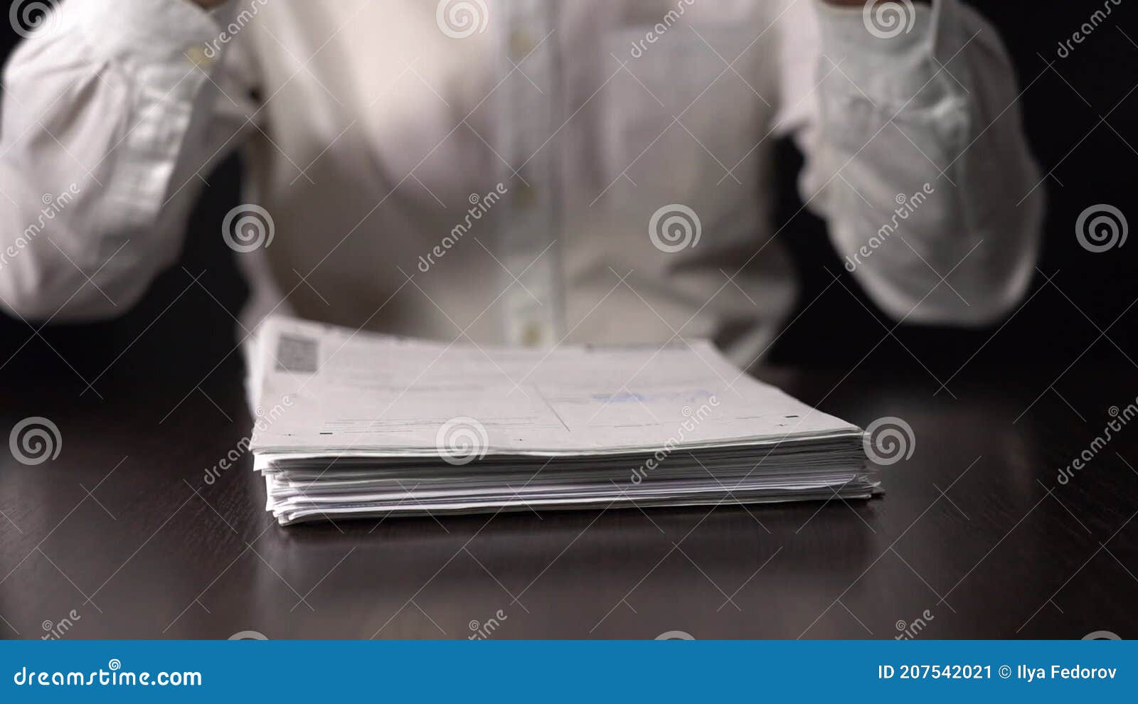 A Stack of Paper Files Falls on the Table. Fists Hit the Pile of Papers ...