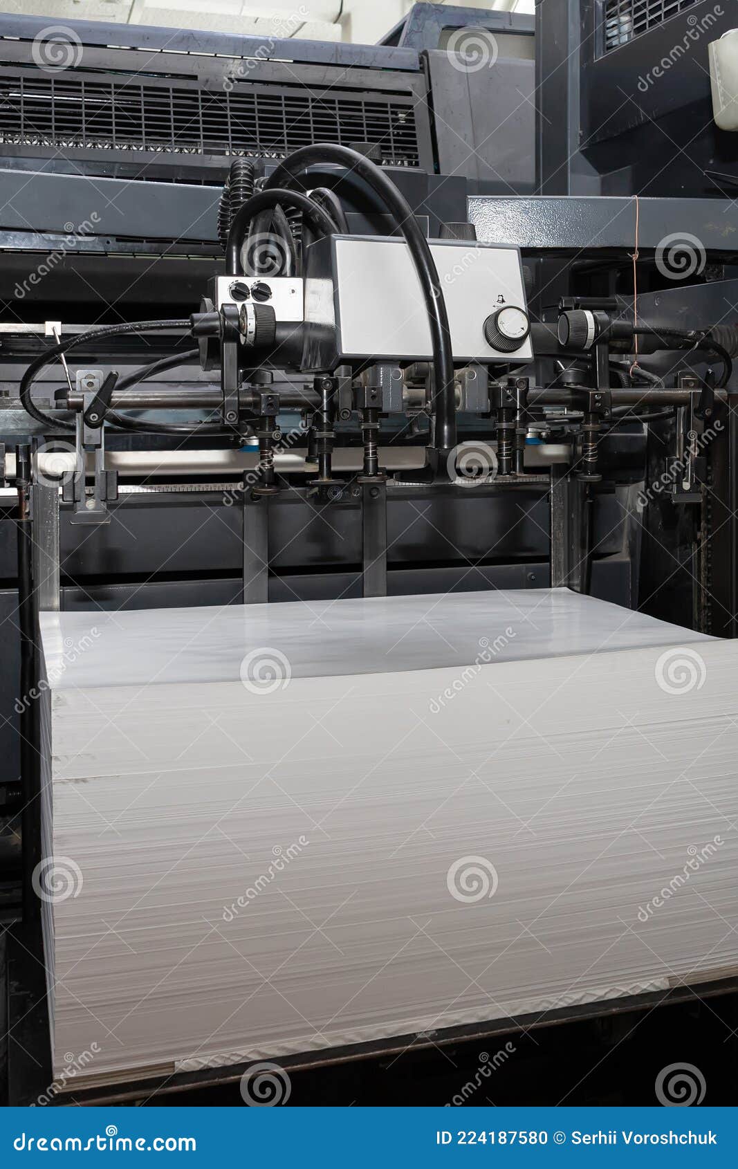 A Stack of Paper is Loaded into a Typewriter Stock Photo - Image of ...