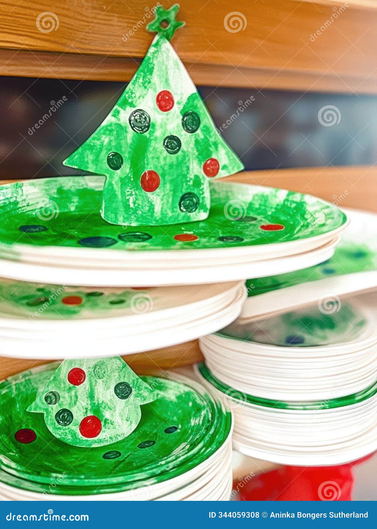 A Stack of Paper Plates with a Green Christmas Tree on Top Stock ...