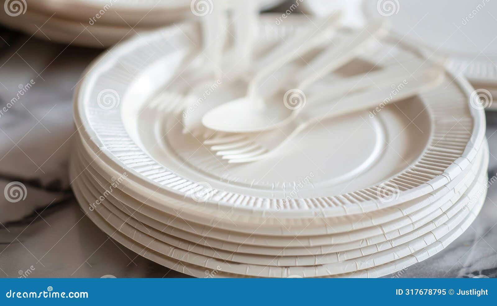 A Stack of Paper Plates and Plastic Utensils Ready To Be Used for the ...