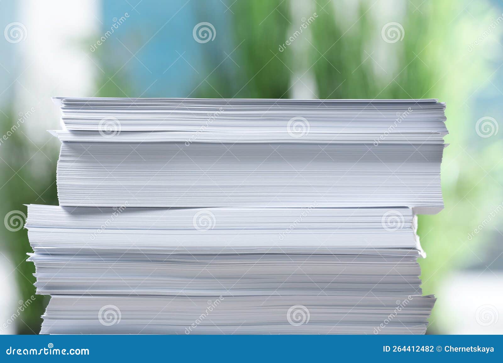 Stack of Paper Sheets Against Blurred Background, Closeup Stock Photo ...