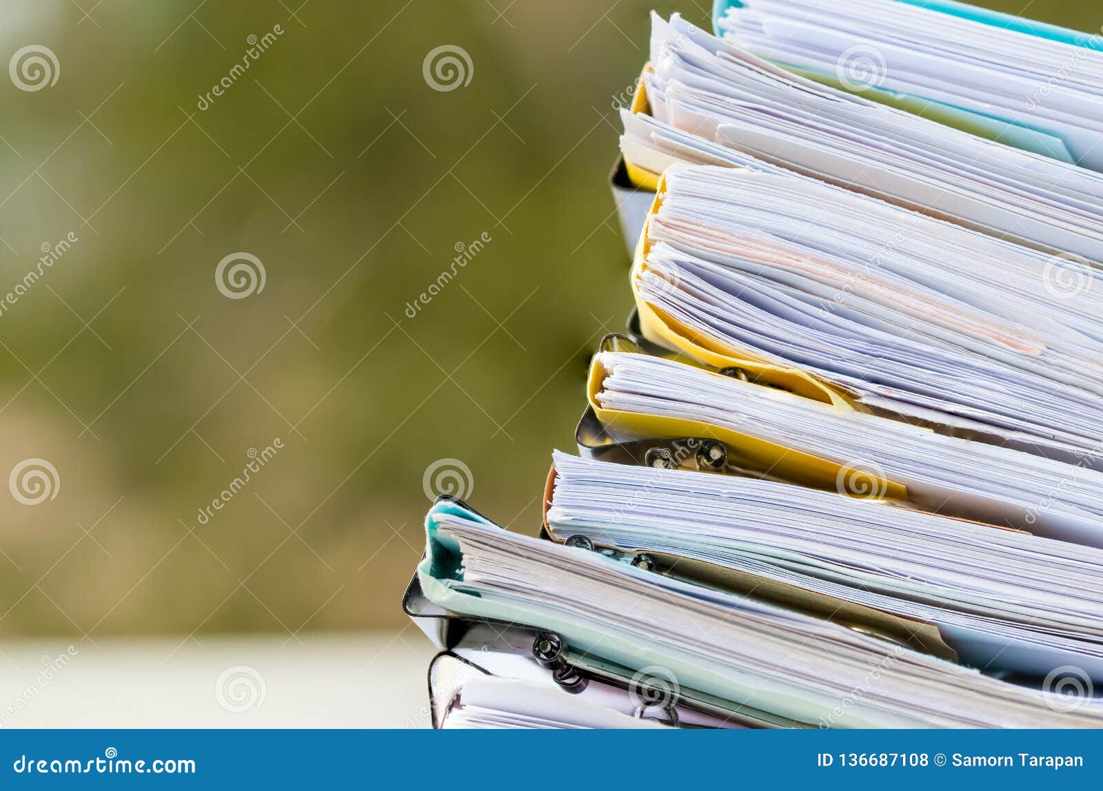 Stack of Papers Documents in Archives Files with Clip Papers on Table ...