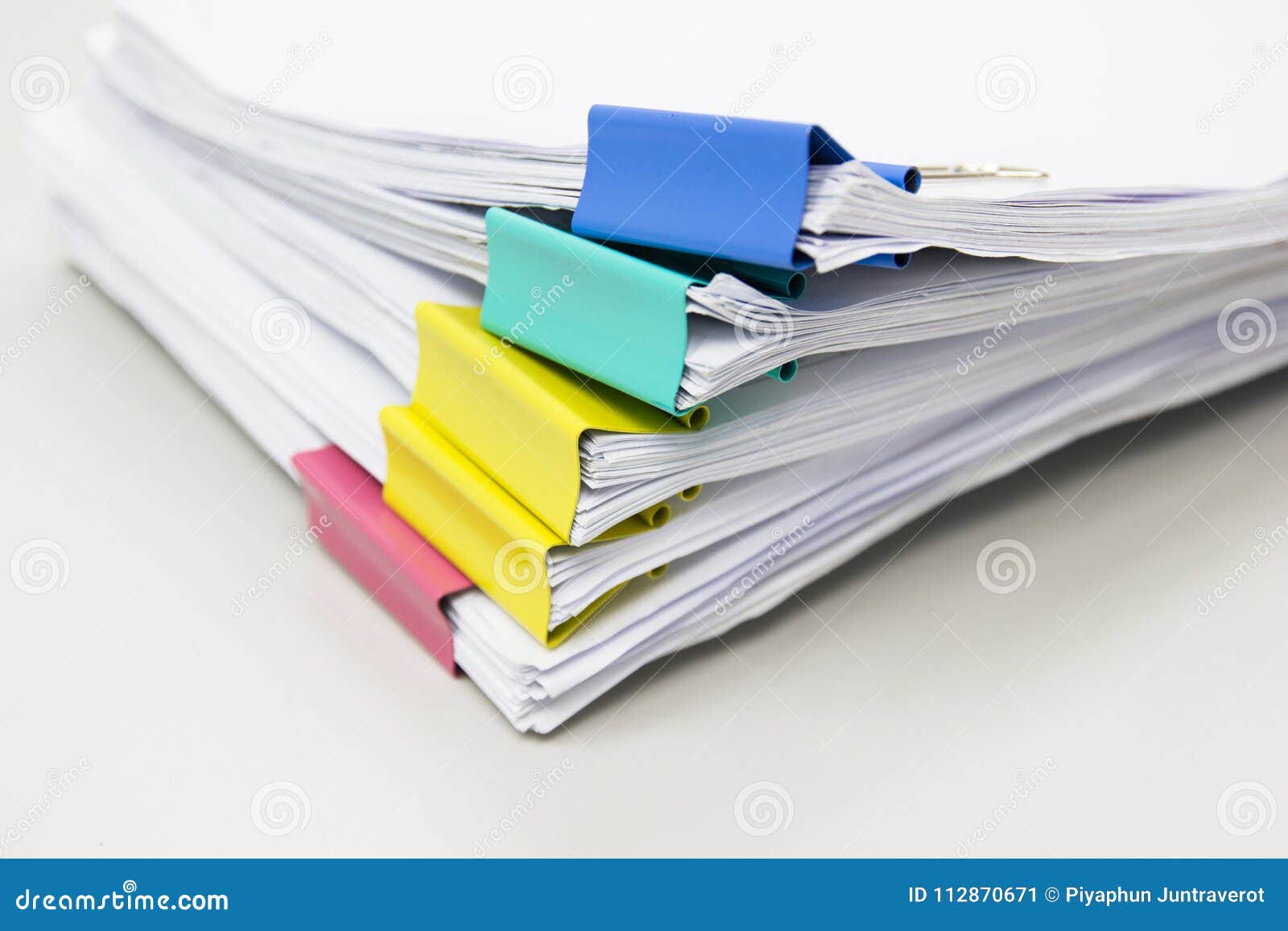 Stack of Papers Documents in Archives Files with Paper Clips on Desk at ...