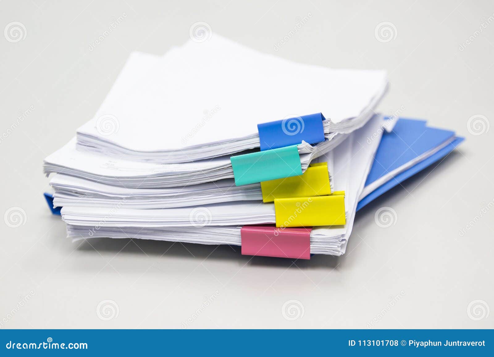 Stack of Papers Documents in Archives Files with Paper Clips on Desk at ...