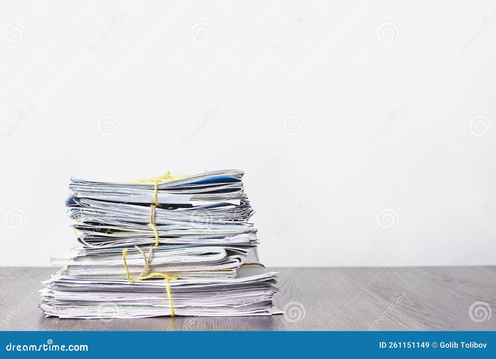 A Stack of Papers on a Table Stock Image - Image of magazine, table ...