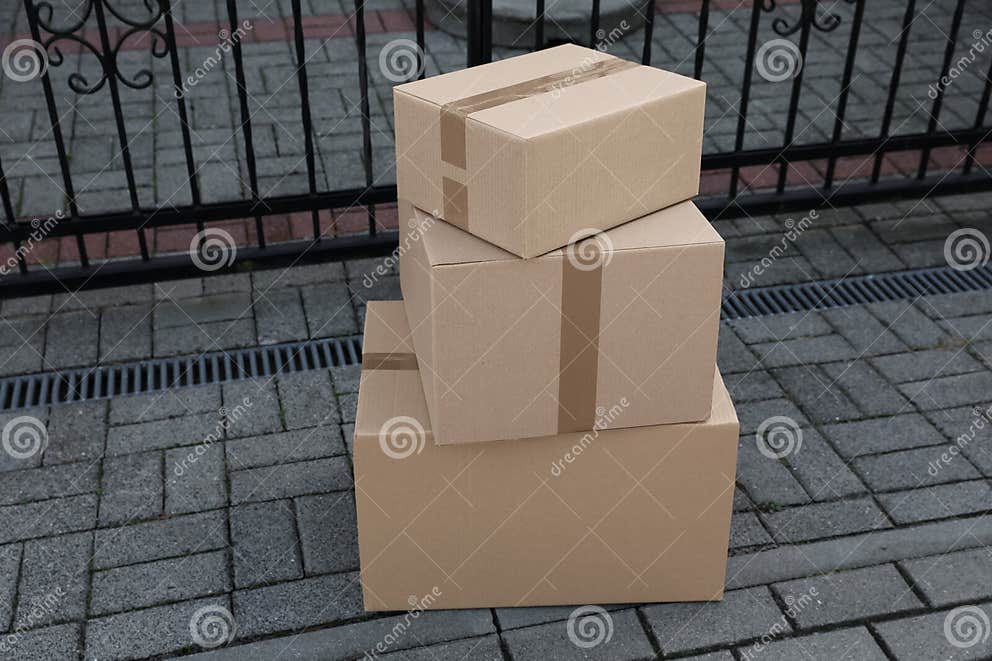Stack of Parcels Delivered Near Front Gates Stock Photo - Image of pack ...