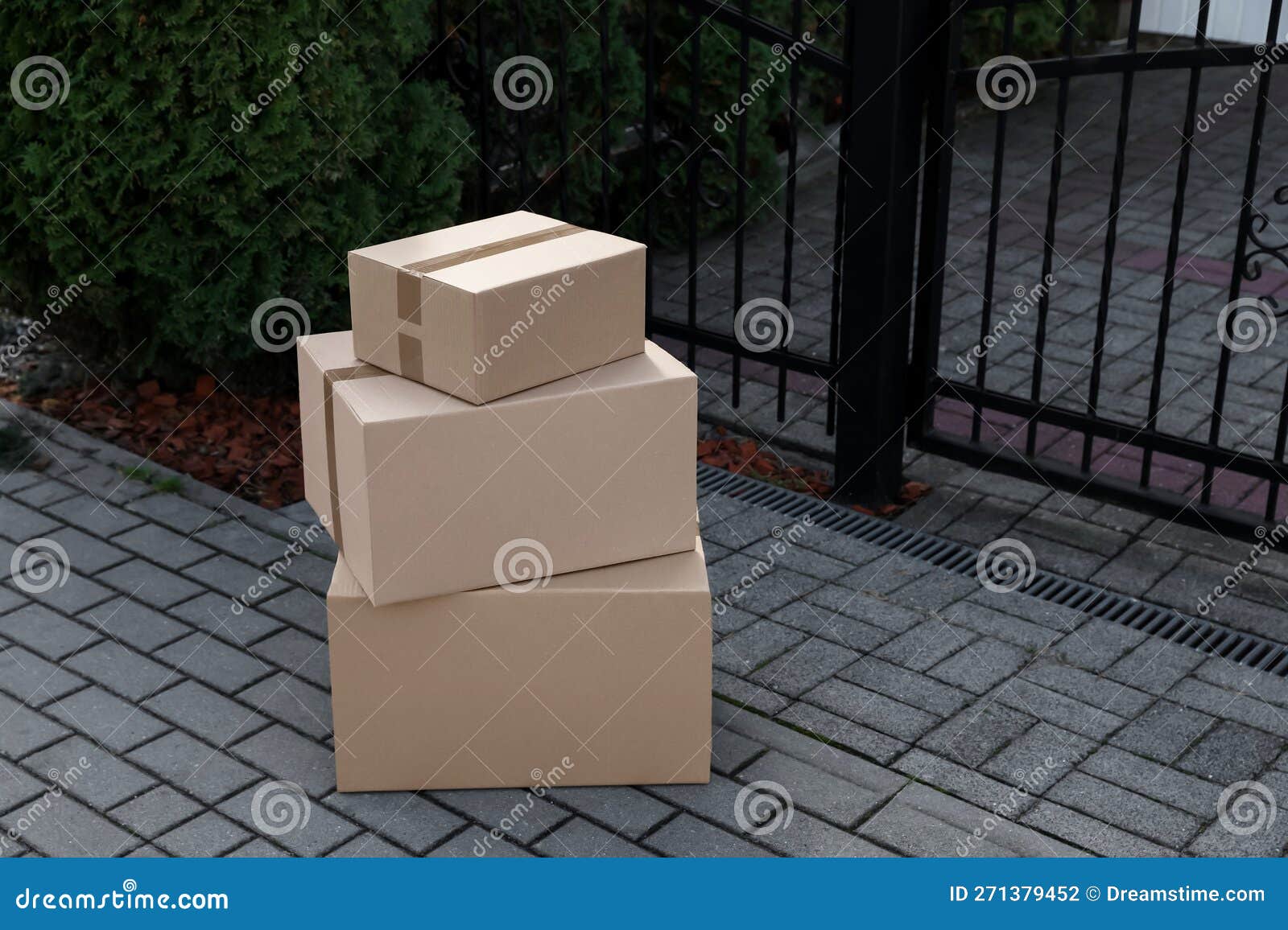 Stack of Parcels Delivered Near Front Gates Stock Photo - Image of pack ...