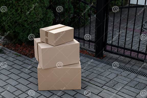 Stack of Parcels Delivered Near Front Gates Stock Photo - Image of pack ...