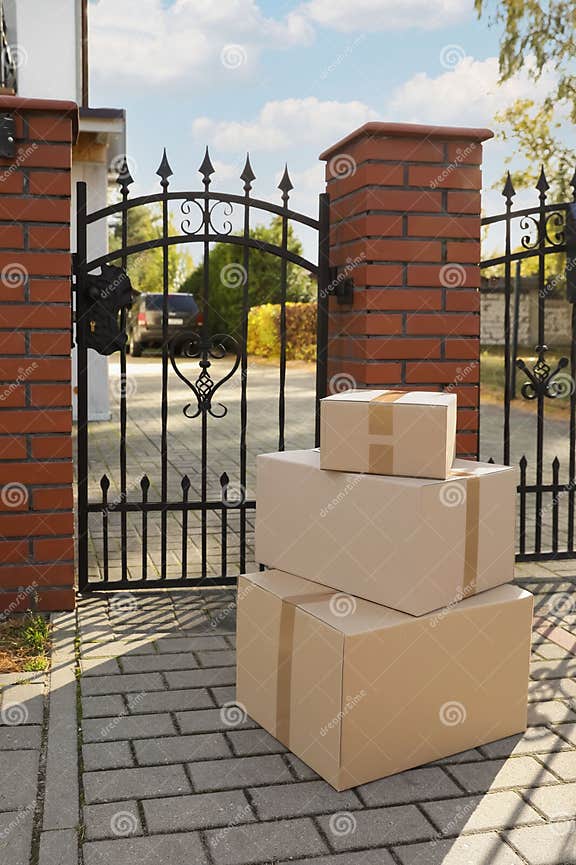 Stack of Parcels Delivered Near Front Gates Stock Image - Image of pack ...