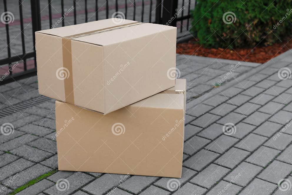 Stack of Parcels Delivered Near Front Gates Stock Photo - Image of home ...