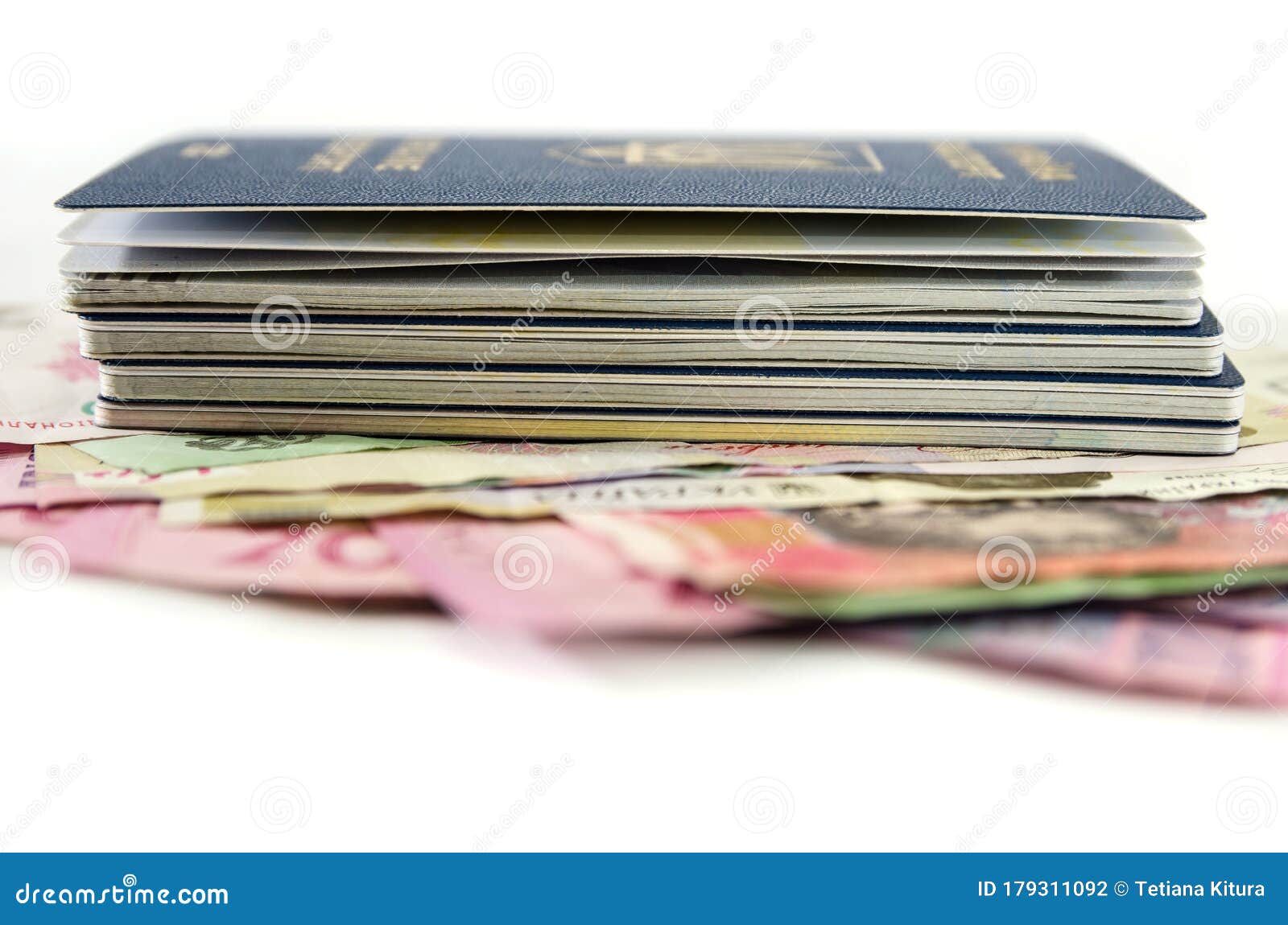 Stack of Passports and Hryvnia. White Background. Side View. Stock ...