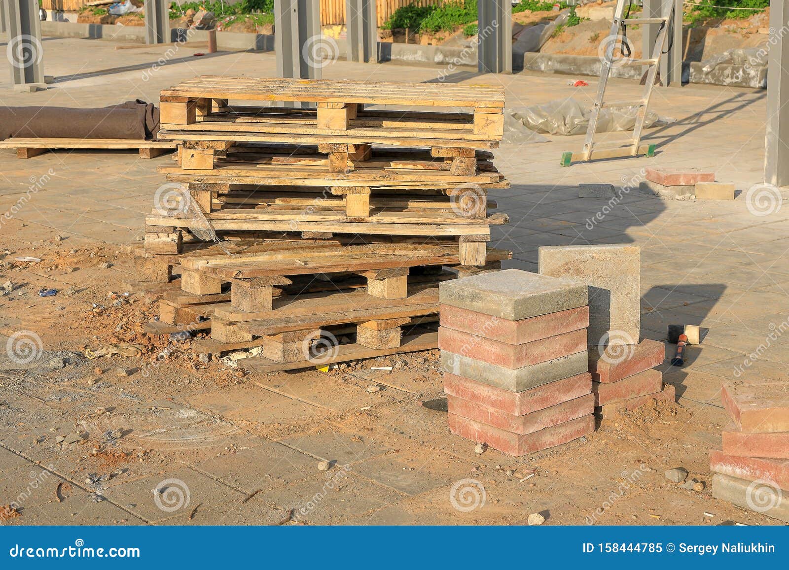A Stack of Paving Slabs and Wooden Pallets from it Stock Image - Image ...