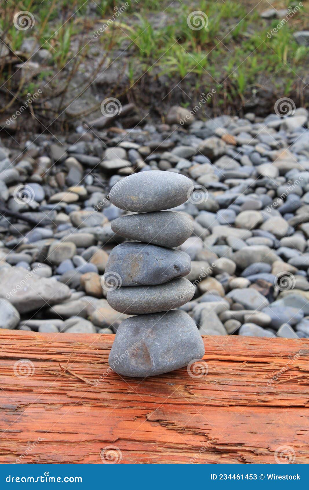 Stack of Pebble Stones Perfectly Balanced on Wood Stock Image - Image ...