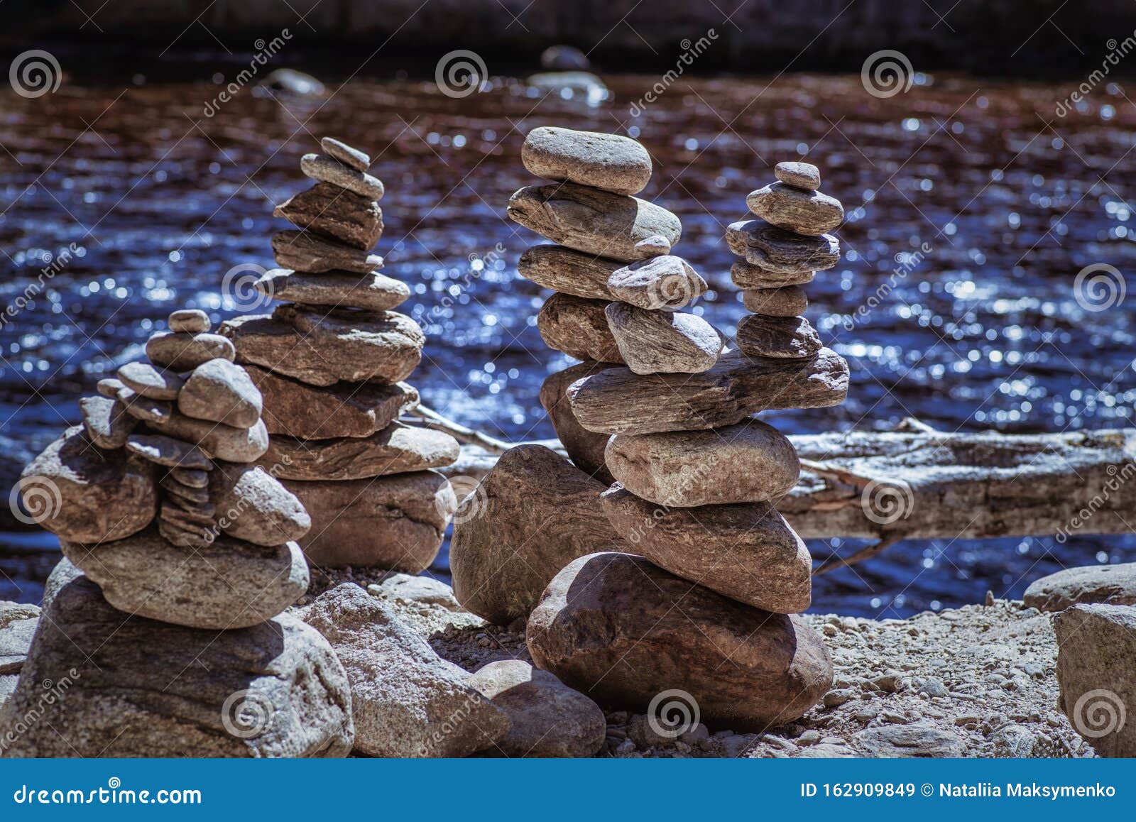 Stack of Pebbles. Balancing on a River Background.Rocks Stacked Close ...