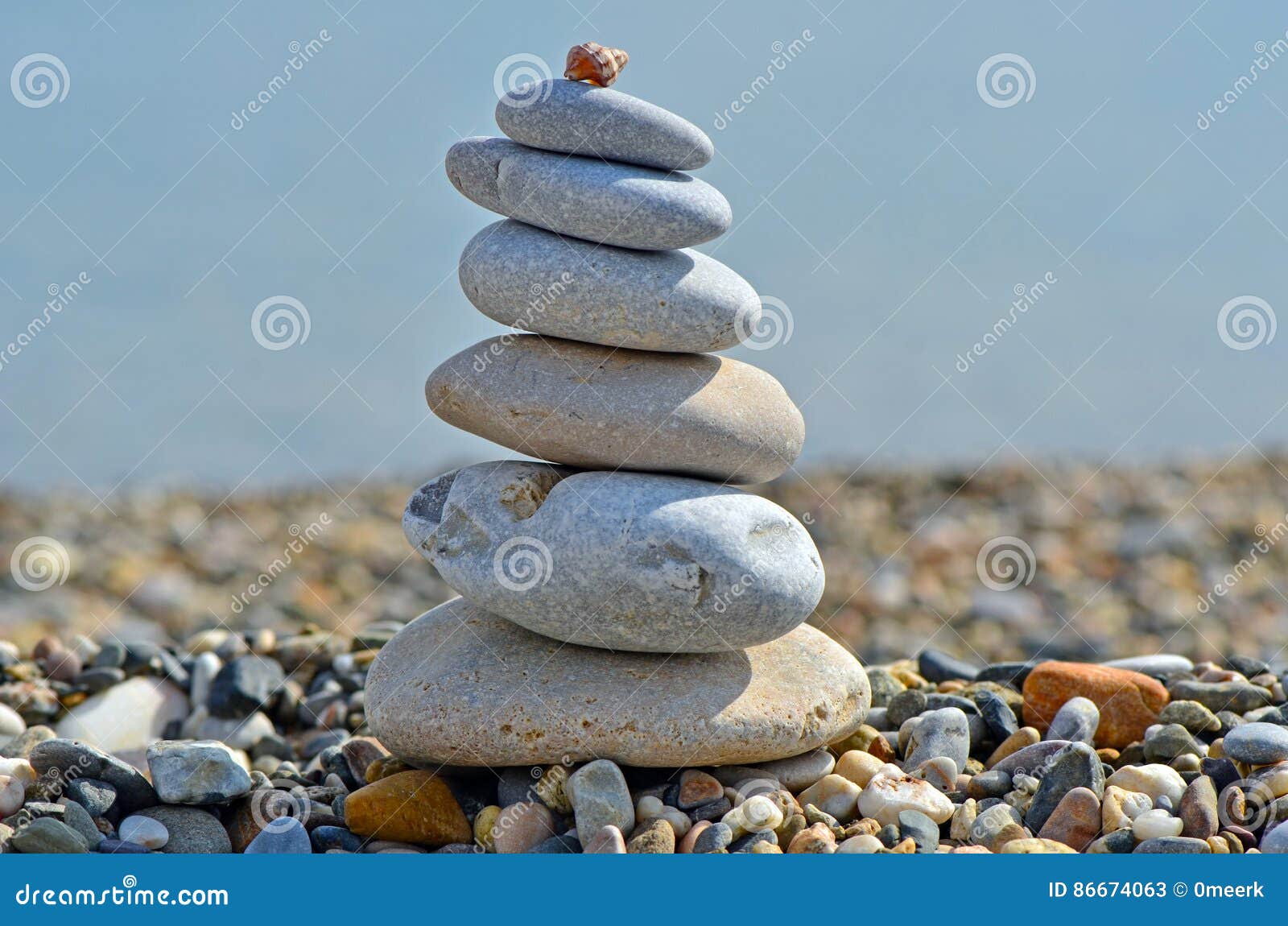 Stack of pebbles on beach stock image. Image of concept - 86674063