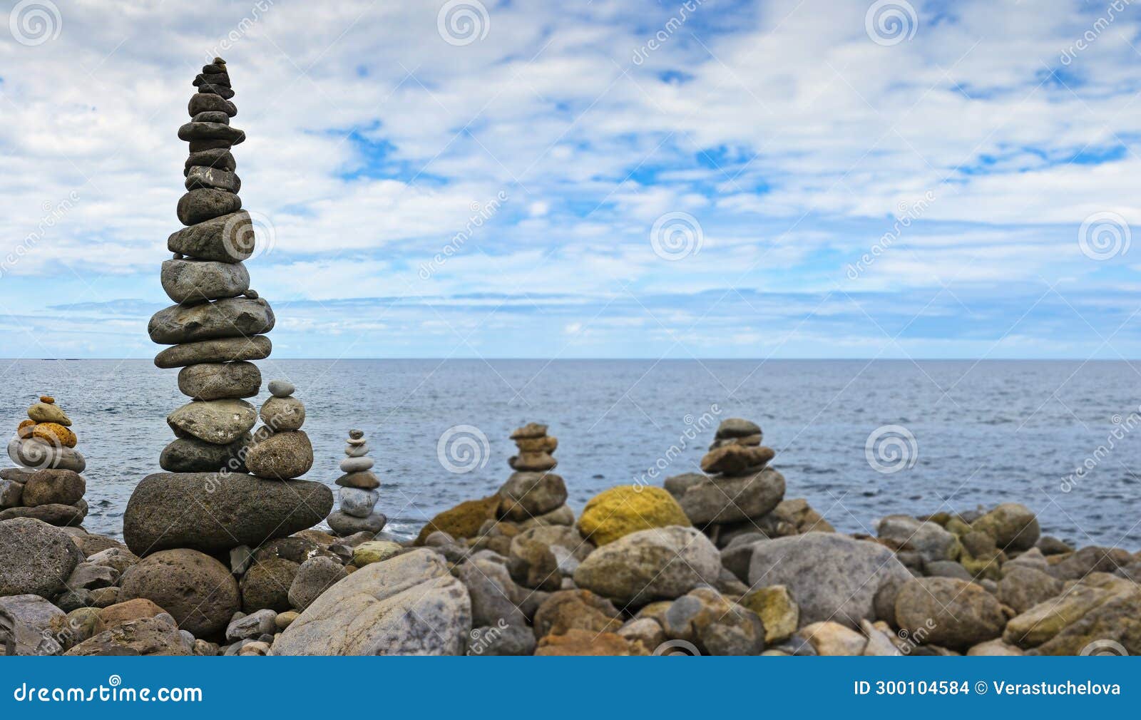 Stack of Pebbles on the Beach and Sea Background Stock Photo - Image of ...
