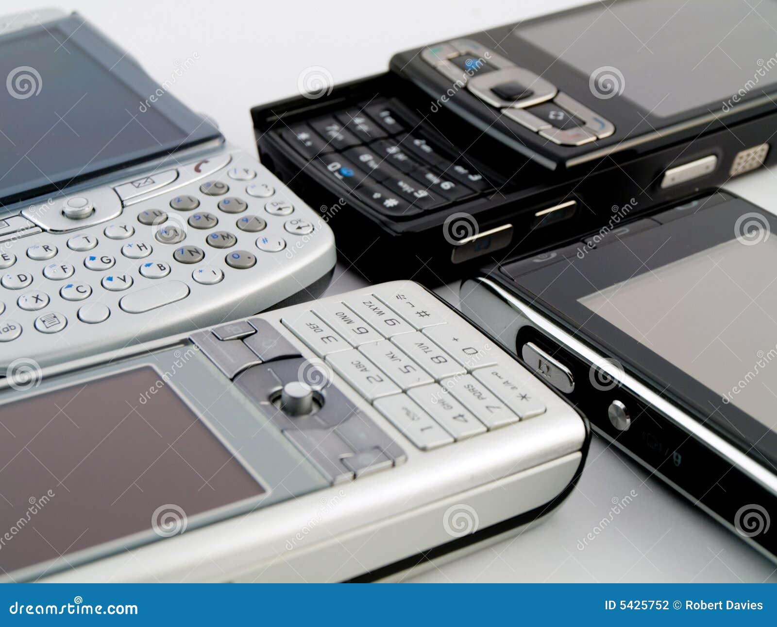 Stack Pile of Several Modern Mobile Phones PDA Stock Photo - Image of ...