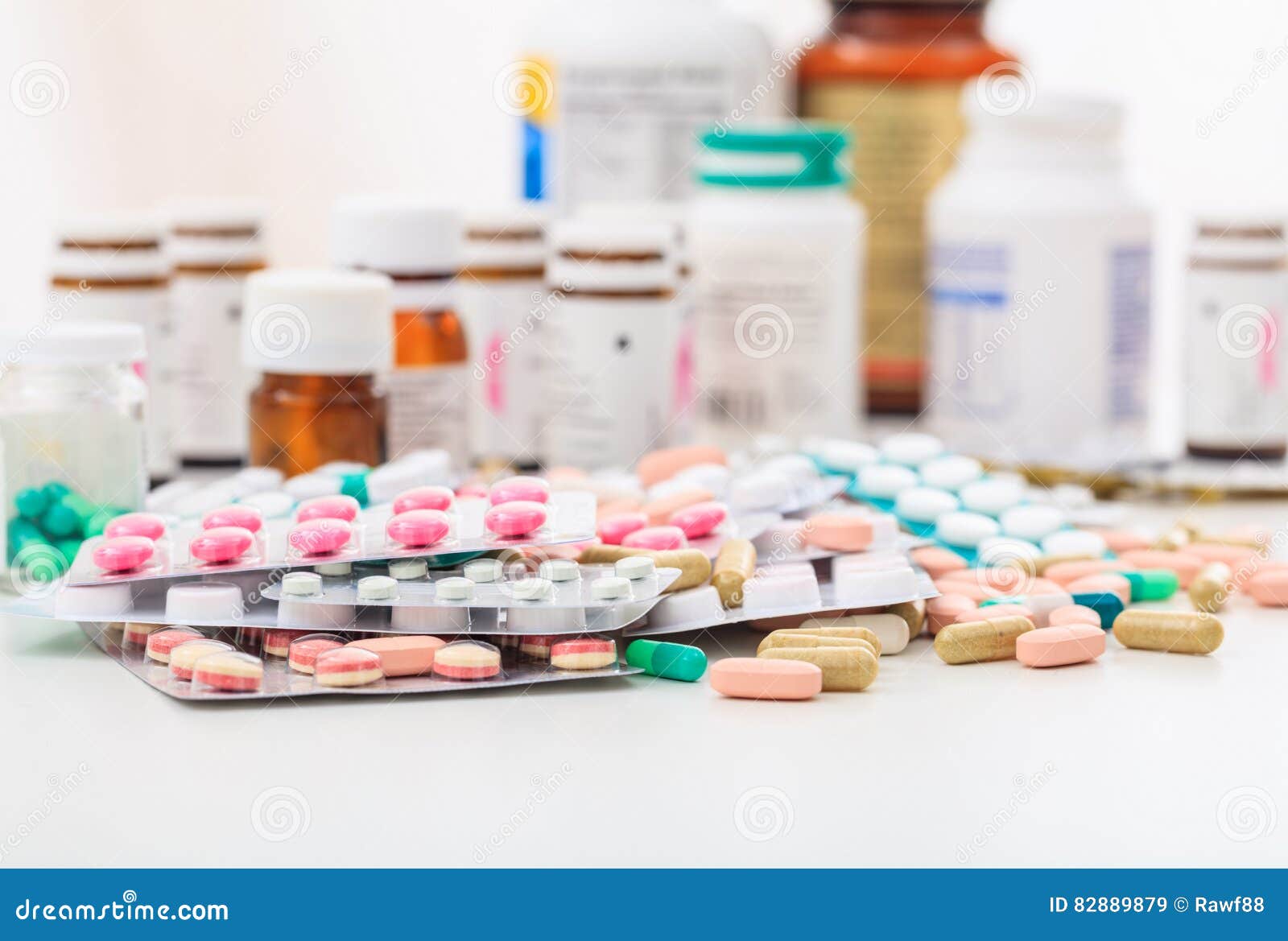 Stack of Pills and Containers on White Background Stock Image - Image ...