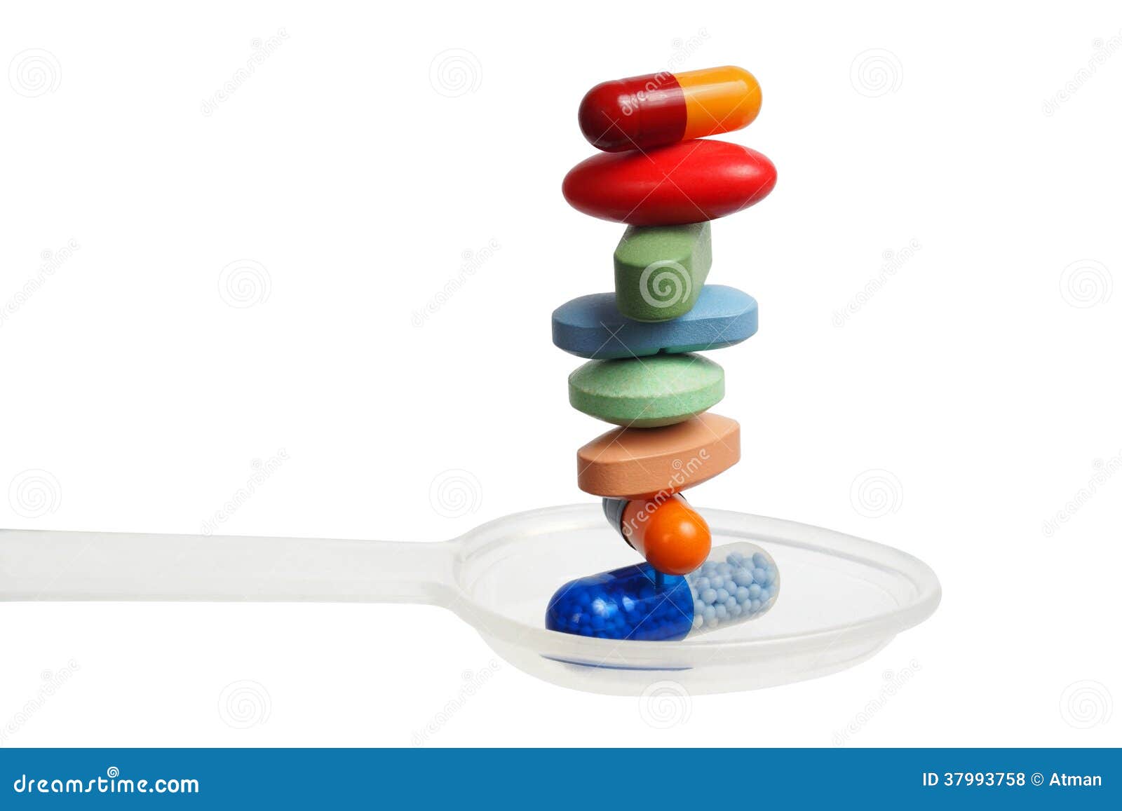 Stack of pills on a spoon stock photo. Image of drugs - 37993758