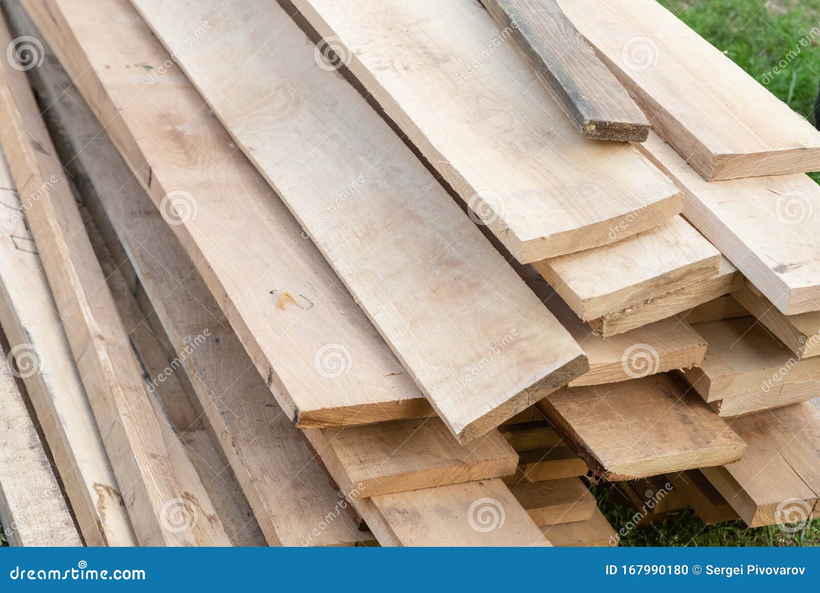 On The Boards Lies A Tool Kit. Electric Circular Saw. Ruler. Hammer ...