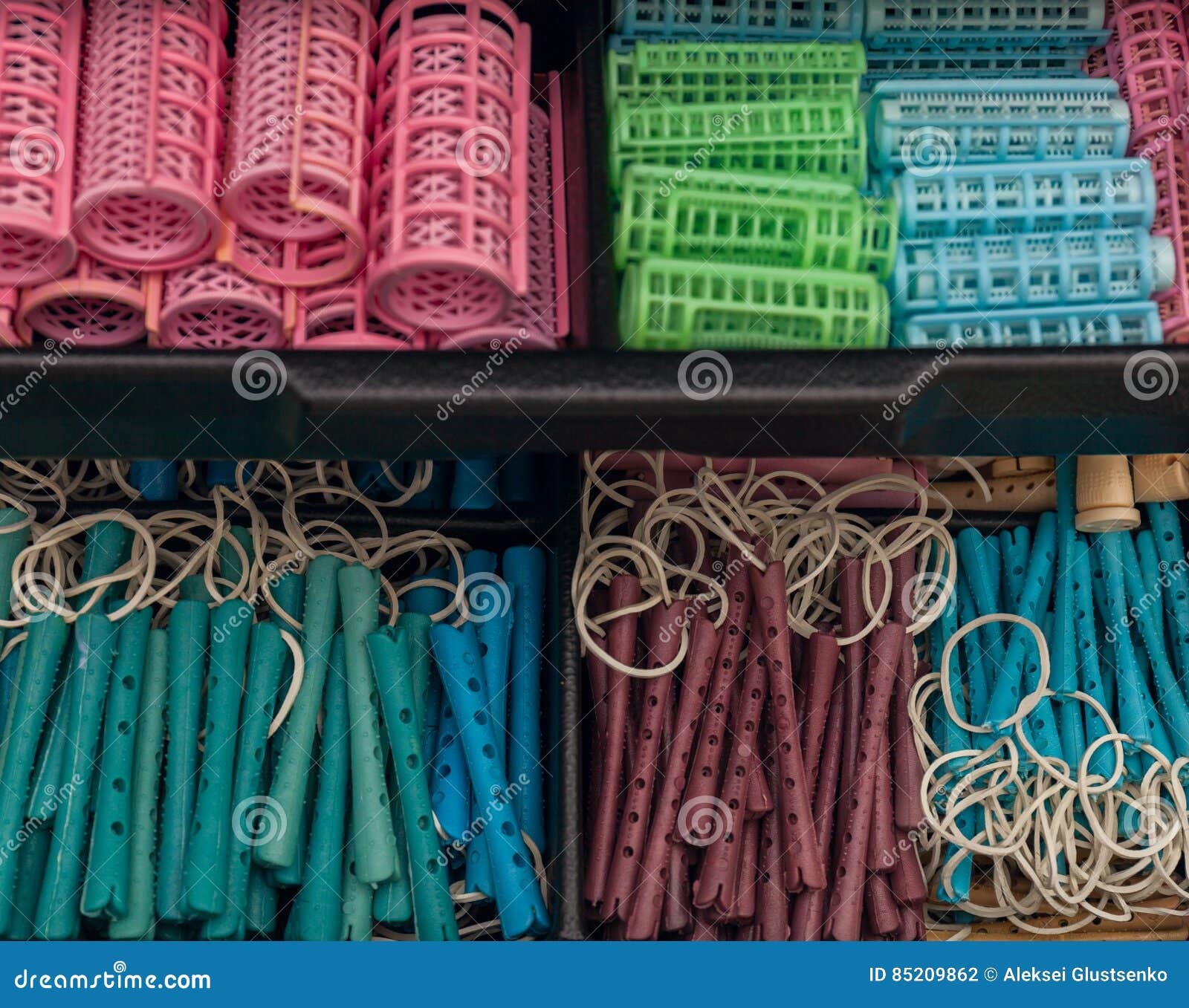 Stack of Pink Hair Rollers Colored Curlers in Different Shapes Stock ...
