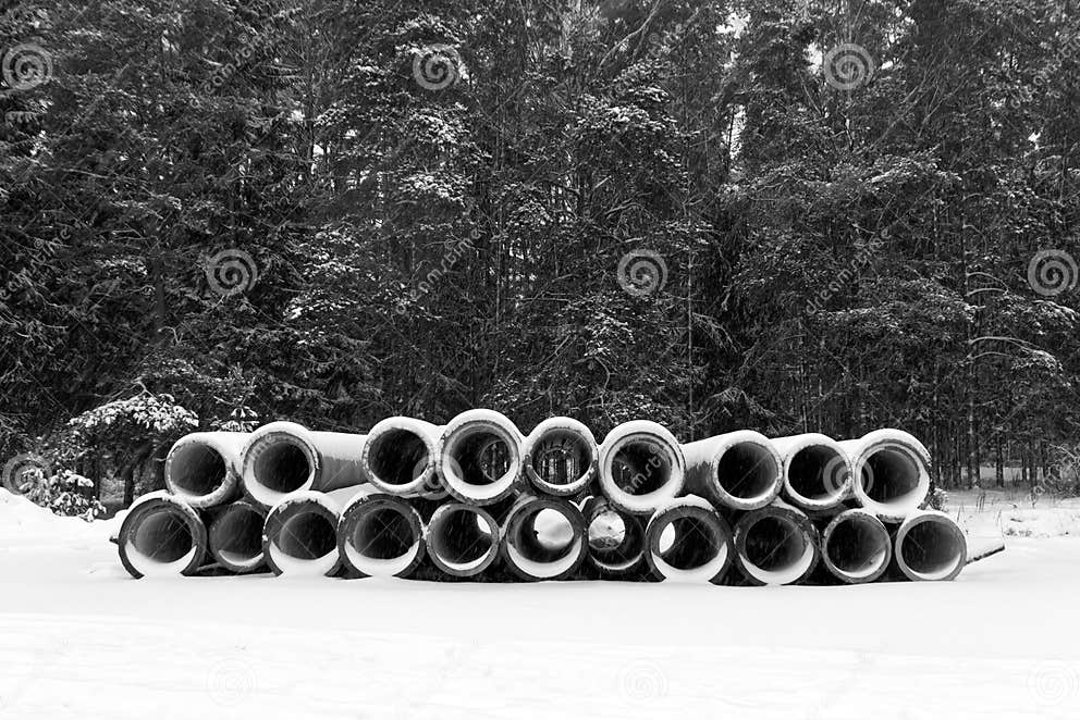 Stack of Pipes and Winter Forest. Stock Photo - Image of color ...