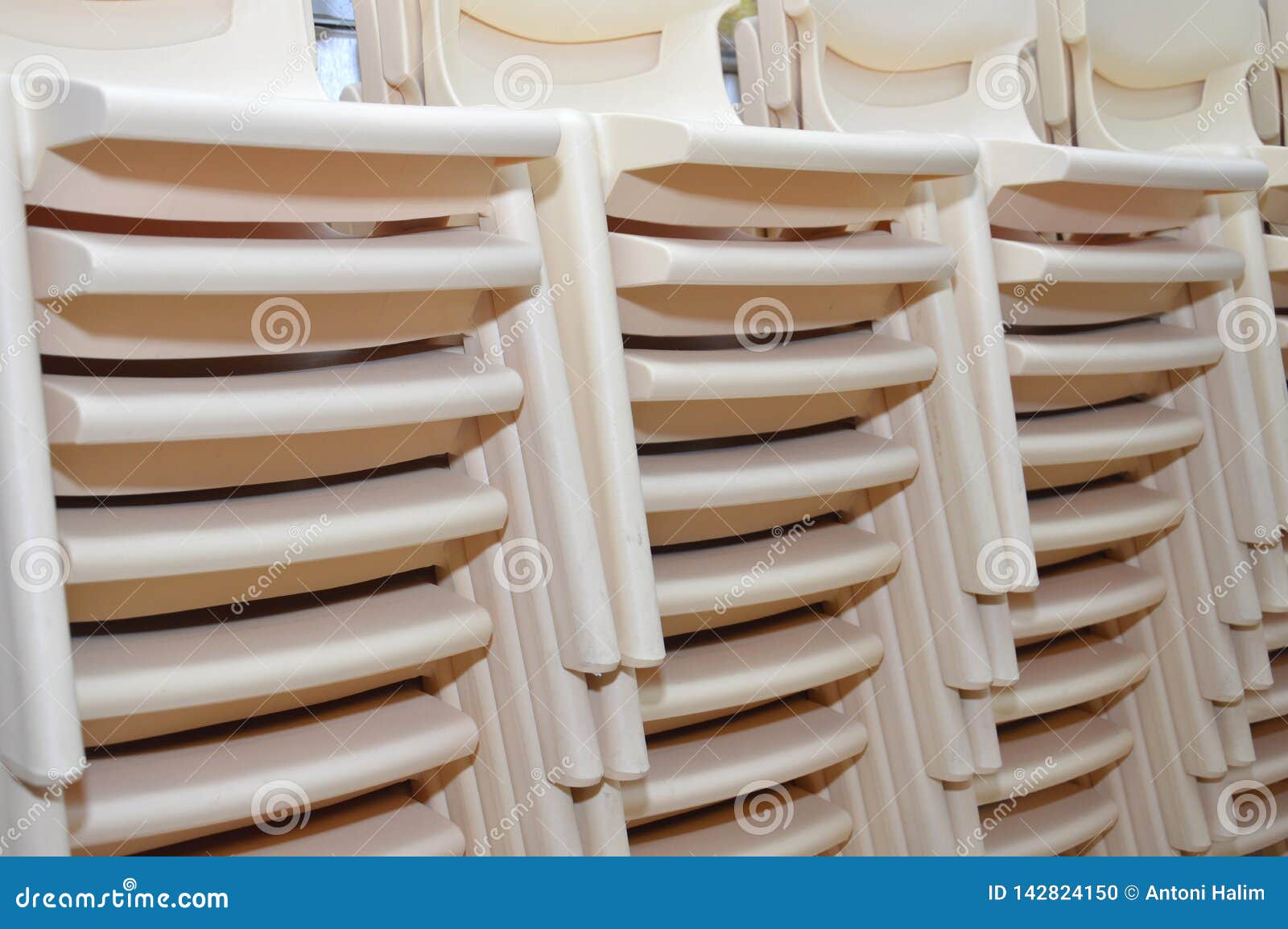 Stack plastic chair stock photo. Image of outdoors, material - 142824150